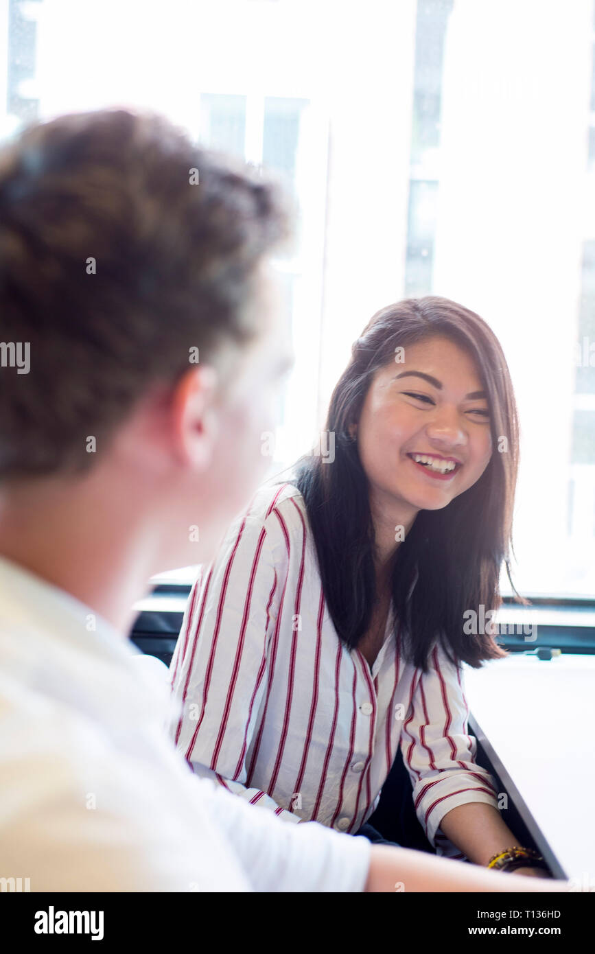 Male female students talking hi-res stock photography and images - Alamy