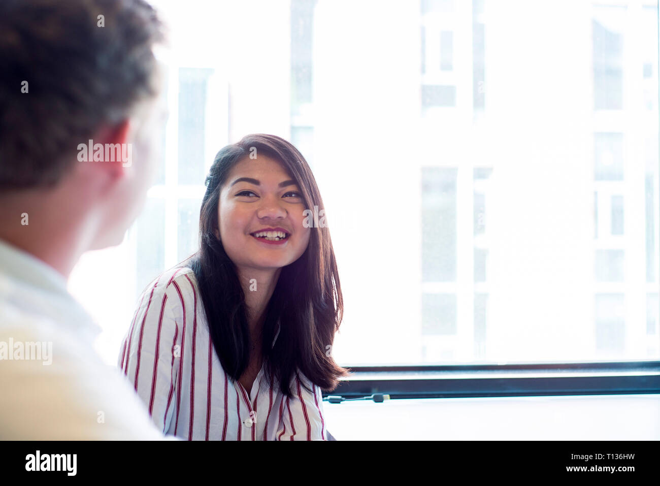 You male and female students sat down chatting and talking while ...