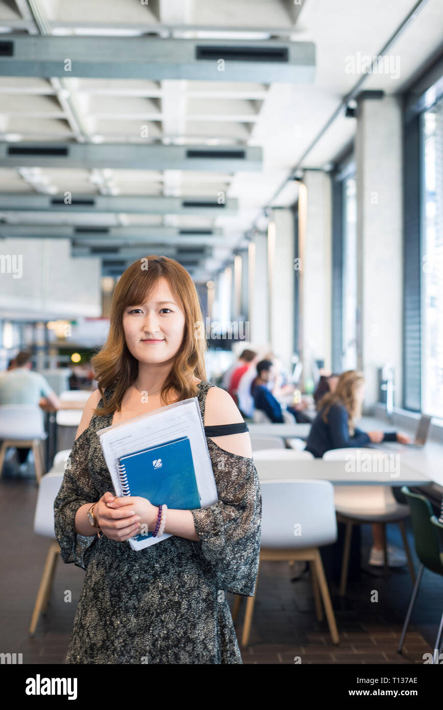 A young south east asian student poses for a photo in a Dutch ...