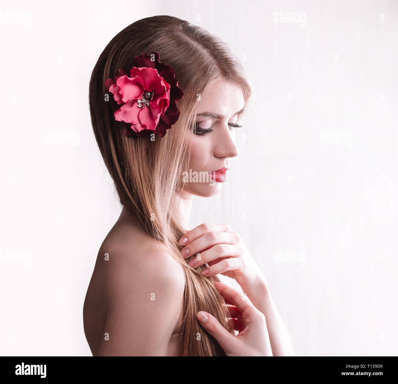 portrait of cute girl with long hair .isolated on light Stock Photo - Alamy