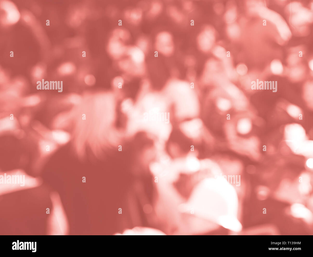 Crowd of people during festival defocused. Coral pink color tone Stock ...