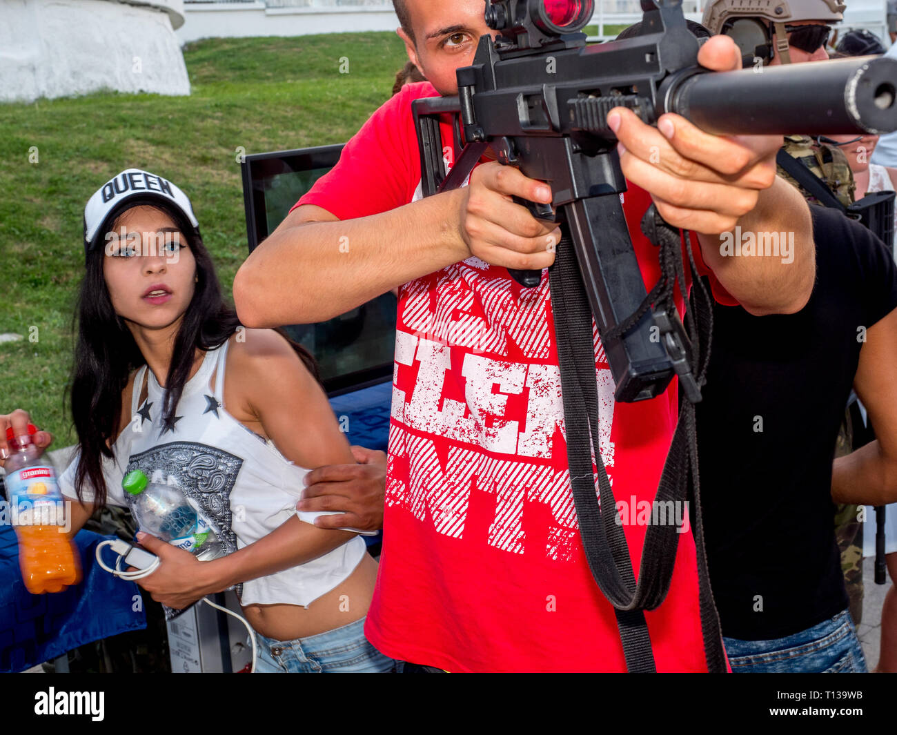 The public handle military weapons on display in Constnata, Romania ...