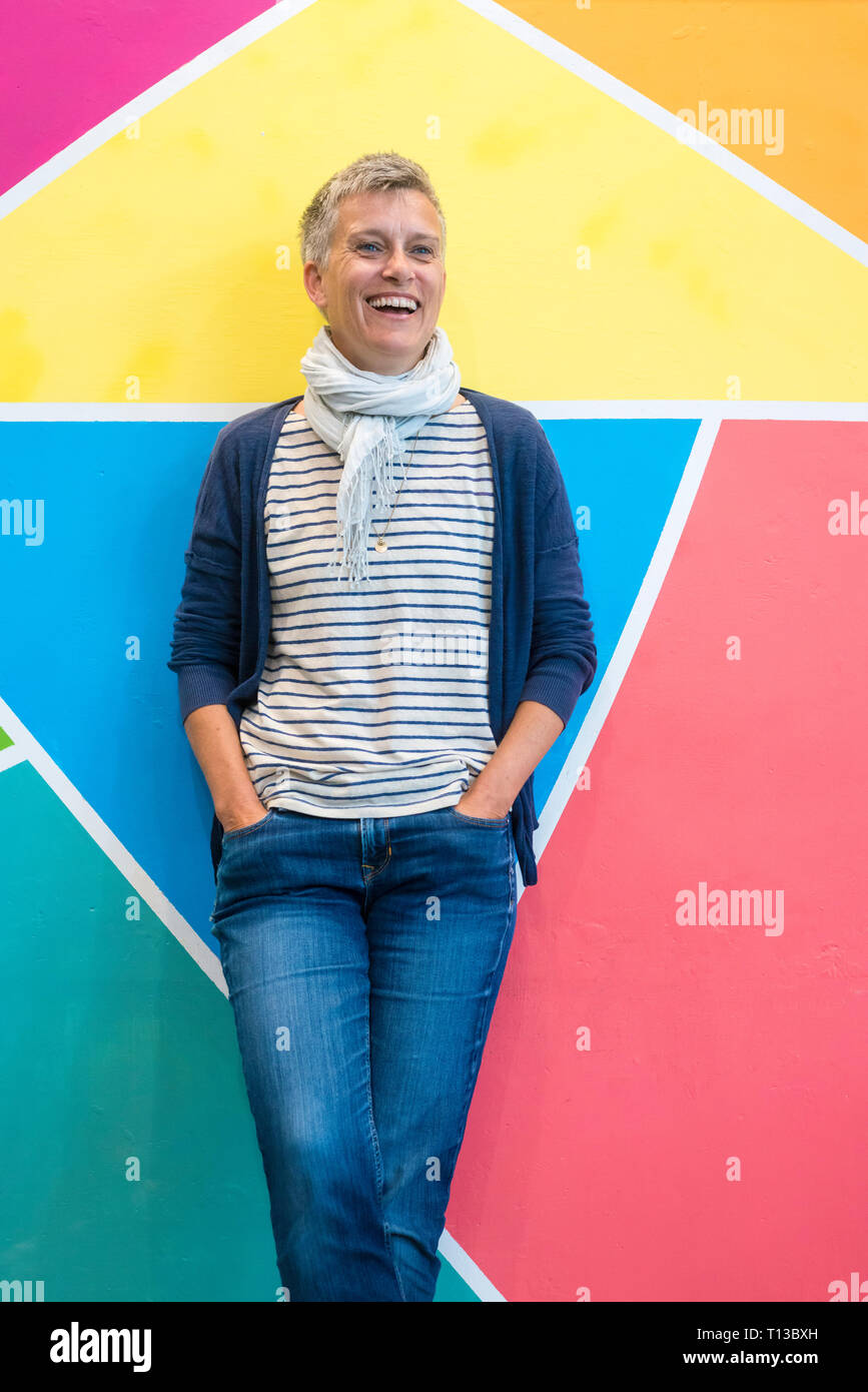 A female creative artist poses in her studio Stock Photo - Alamy
