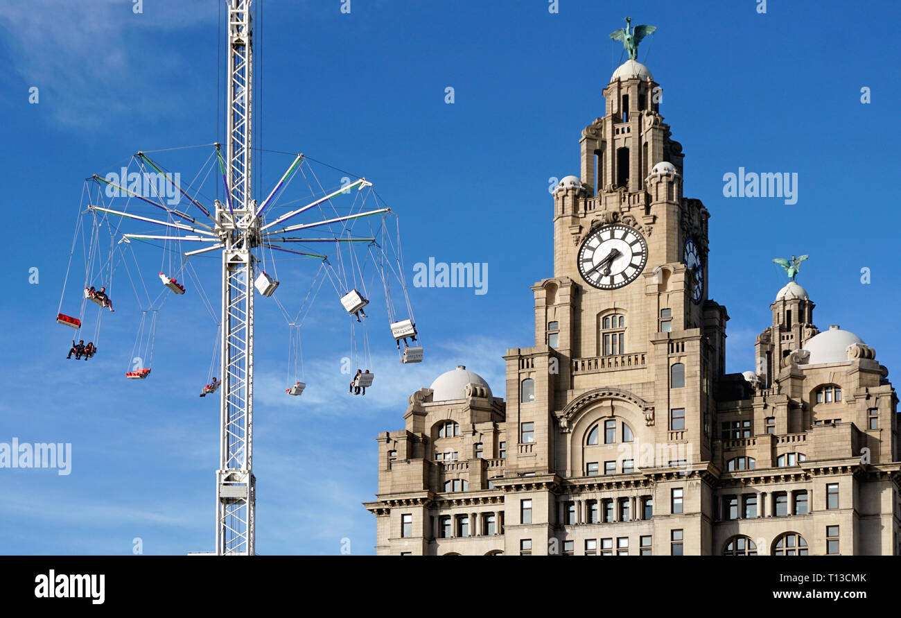 Fairground Ride In Front Of The Royal Liver Building, Liverpool Stock ...
