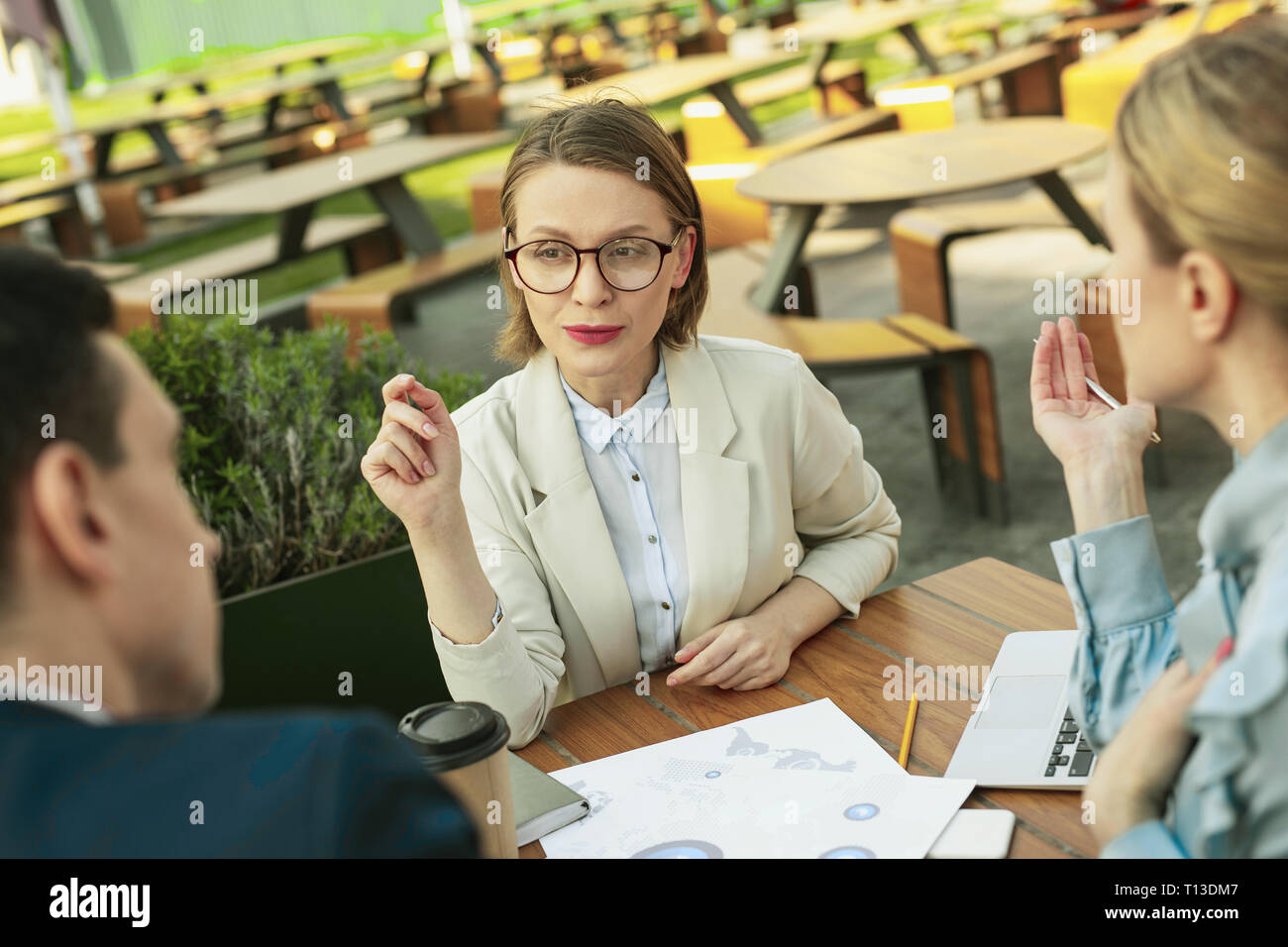 Beautiful smart woman wearing white jacket to meeting Stock Photo - Alamy