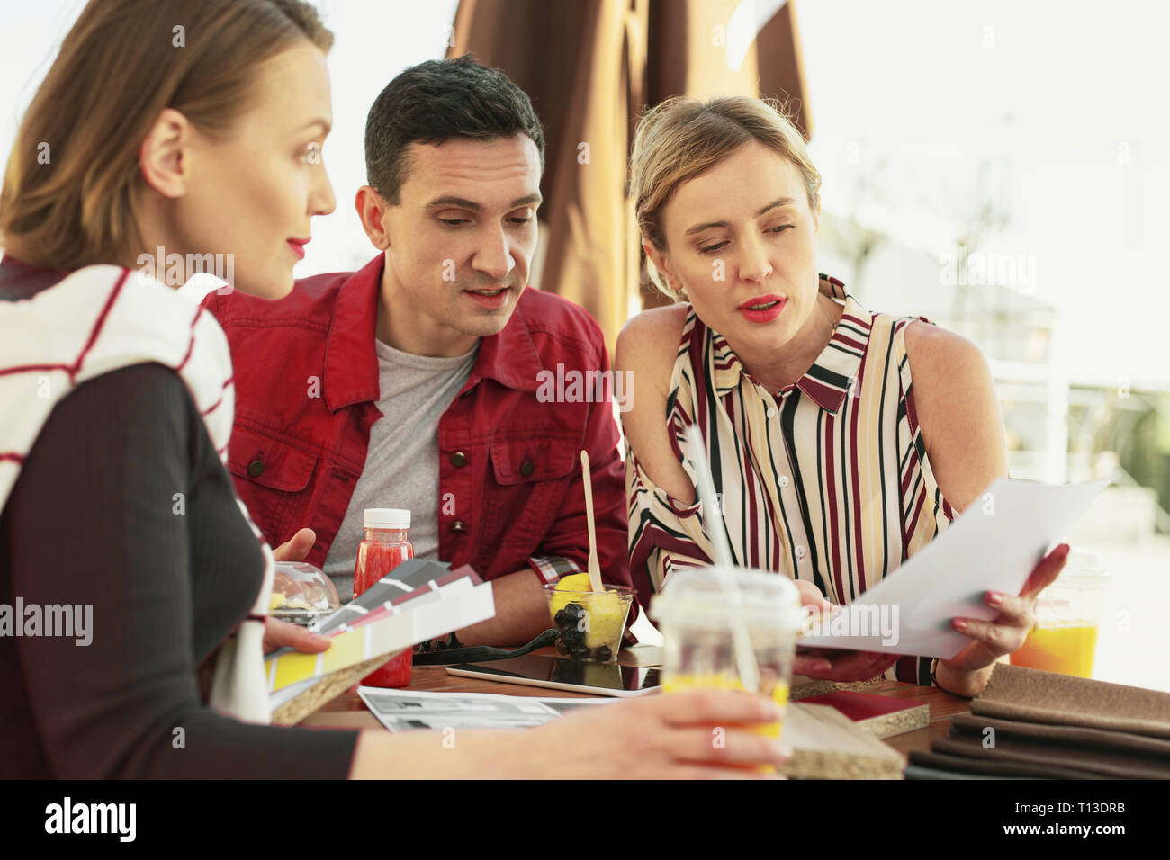 Lovely young pair choosing color from palette Stock Photo - Alamy