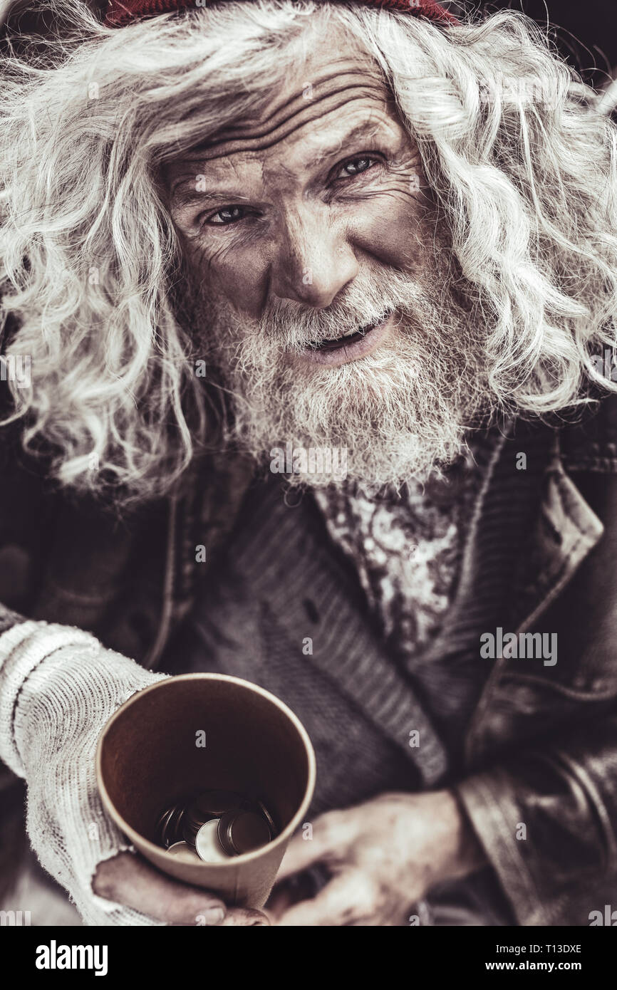 Homeless holding cup hi-res stock photography and images - Alamy