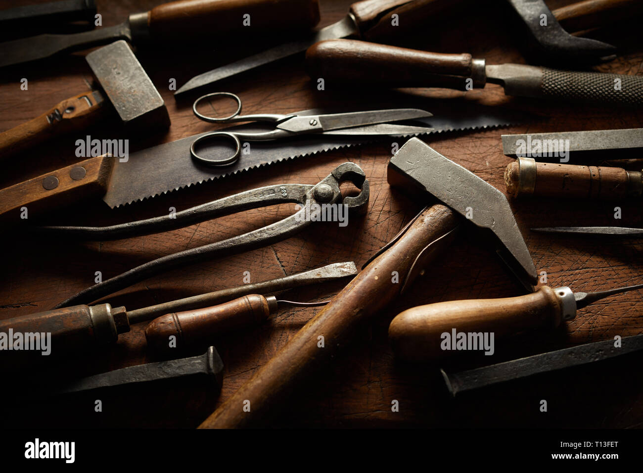 Collection of vintage woodworking hand tools with wood handles arranged ...