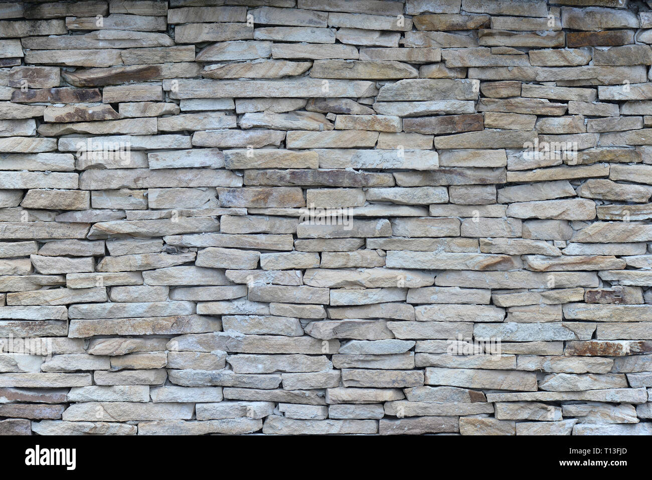Stacked stone wall background horizontal Stock Photo - Alamy