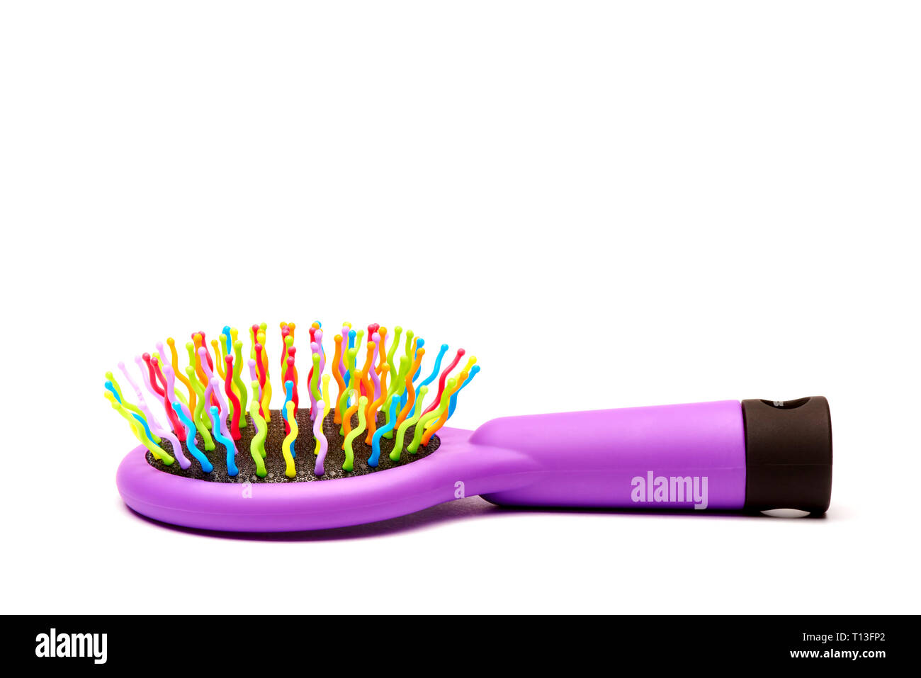 Bright multi-colored hair comb on a white background.Copy space Stock ...