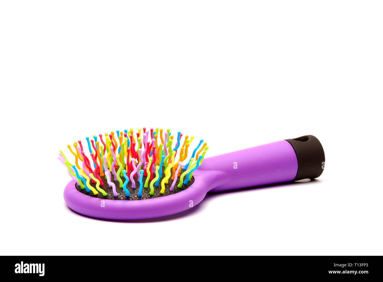 Bright multi-colored hair comb on a white background Stock Photo - Alamy