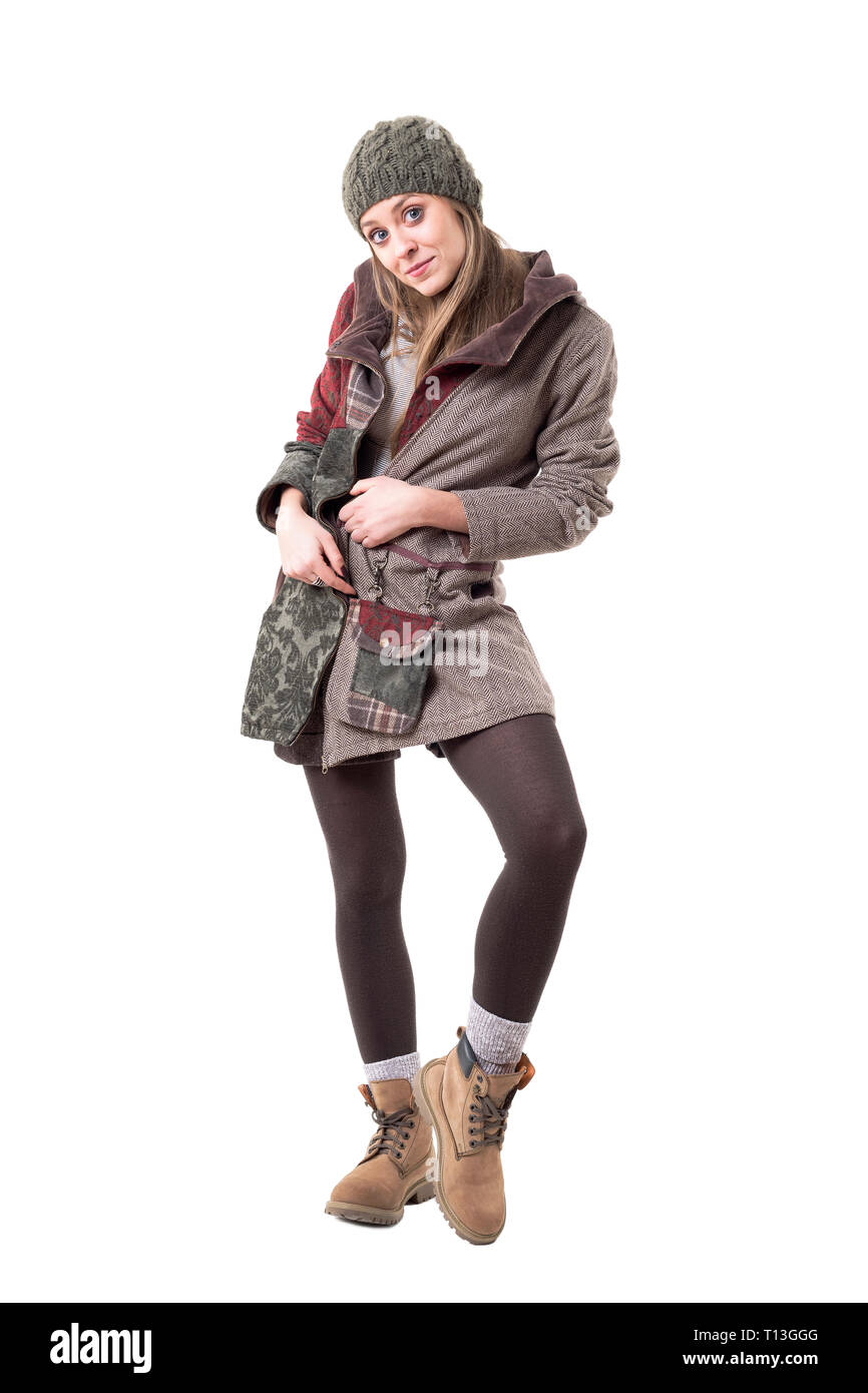 Cute charming young woman wearing boots, beanie cap and warm winter ...