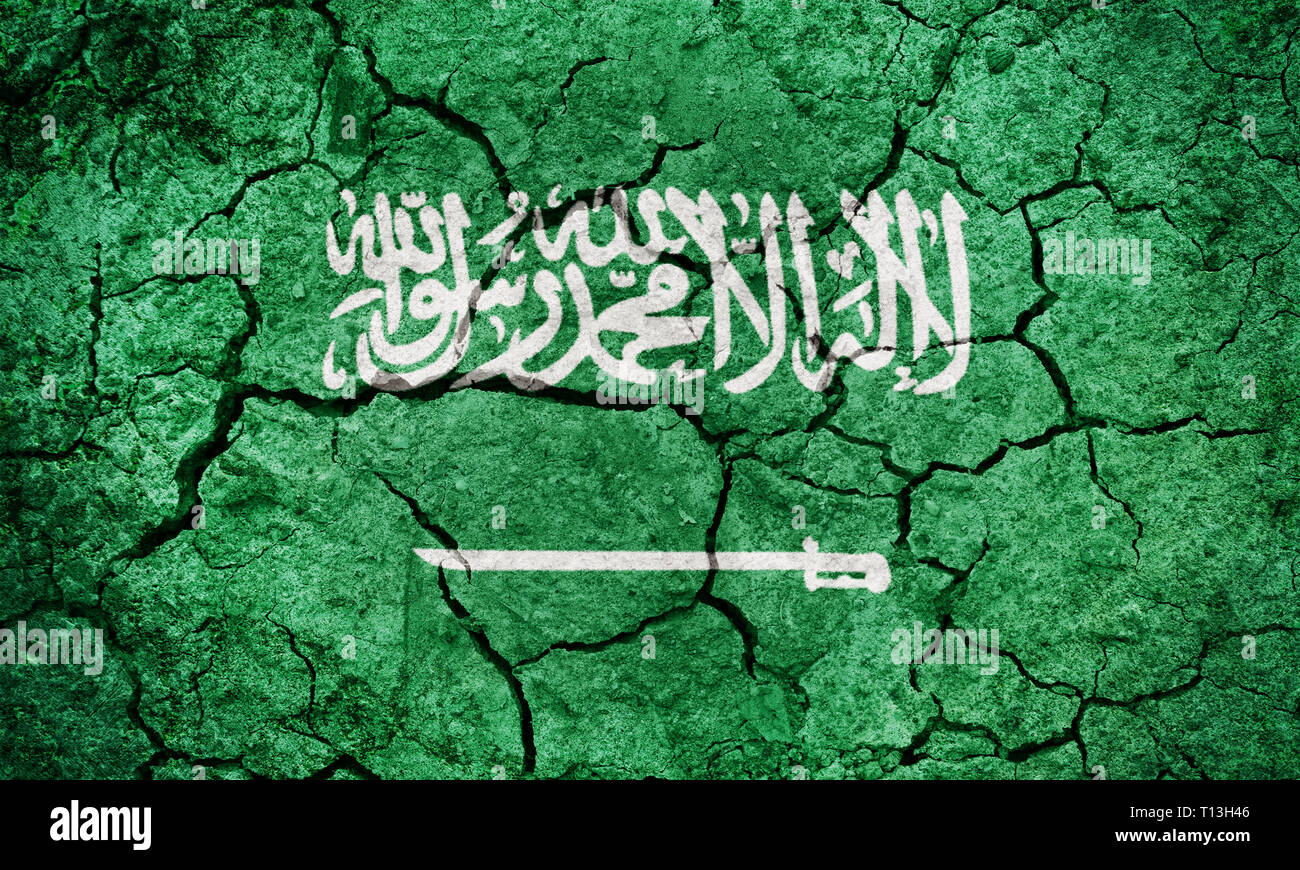 Flag of the Kingdom of Saudi Arabia on dry earth ground texture ...