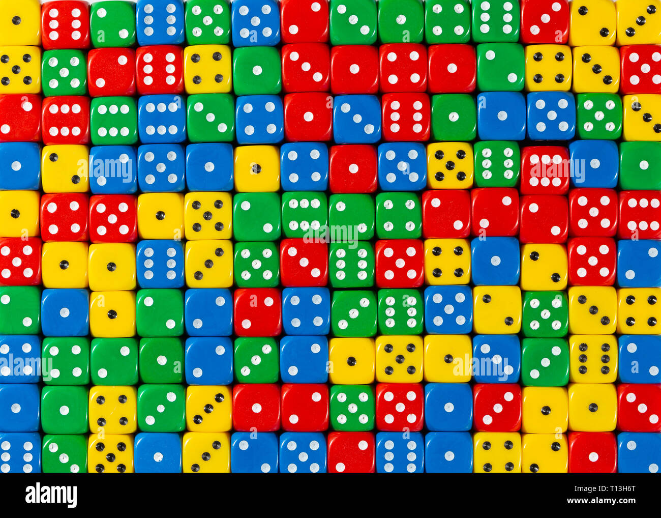 Pattern of random ordered red, yellow, green and blue dices Stock Photo ...