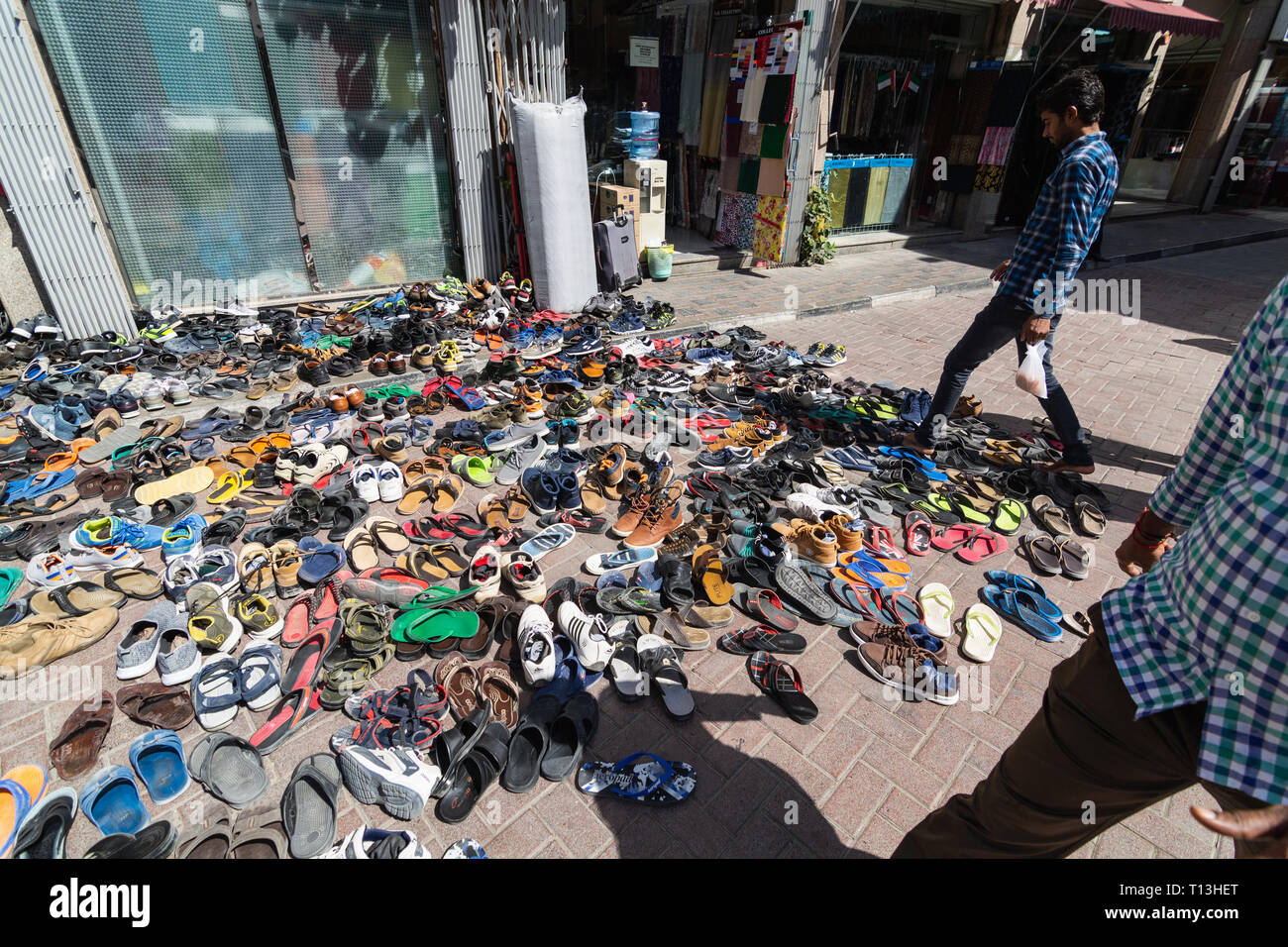 DUBAI, UNITED ARAB EMIRATES - MARCH 2019: man taking his shoes off on ...