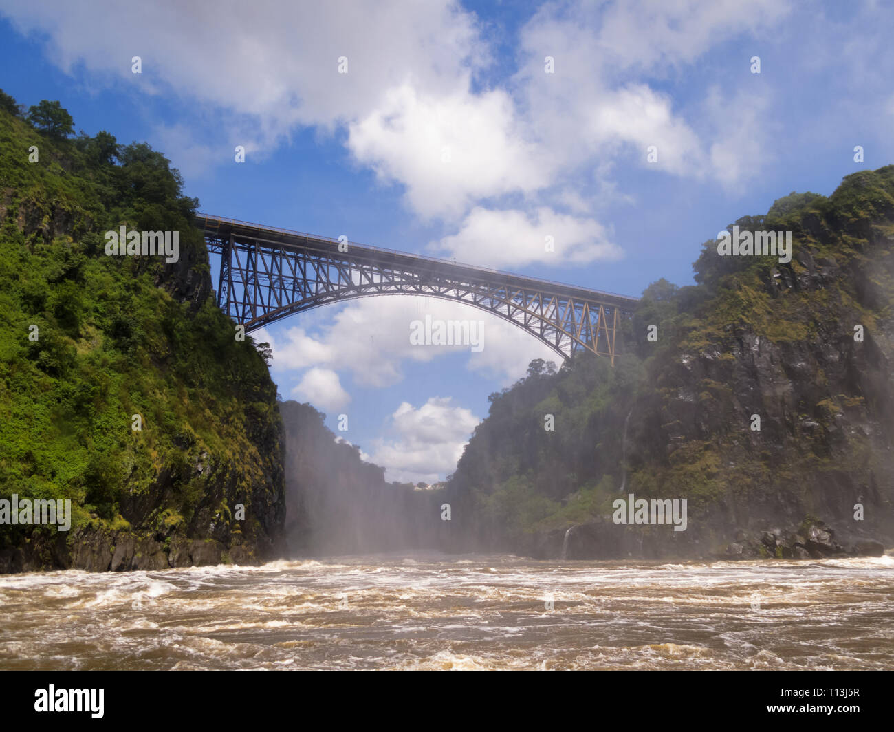 High bridge over rapidly flowing river gorge on sunny day Stock Photo ...