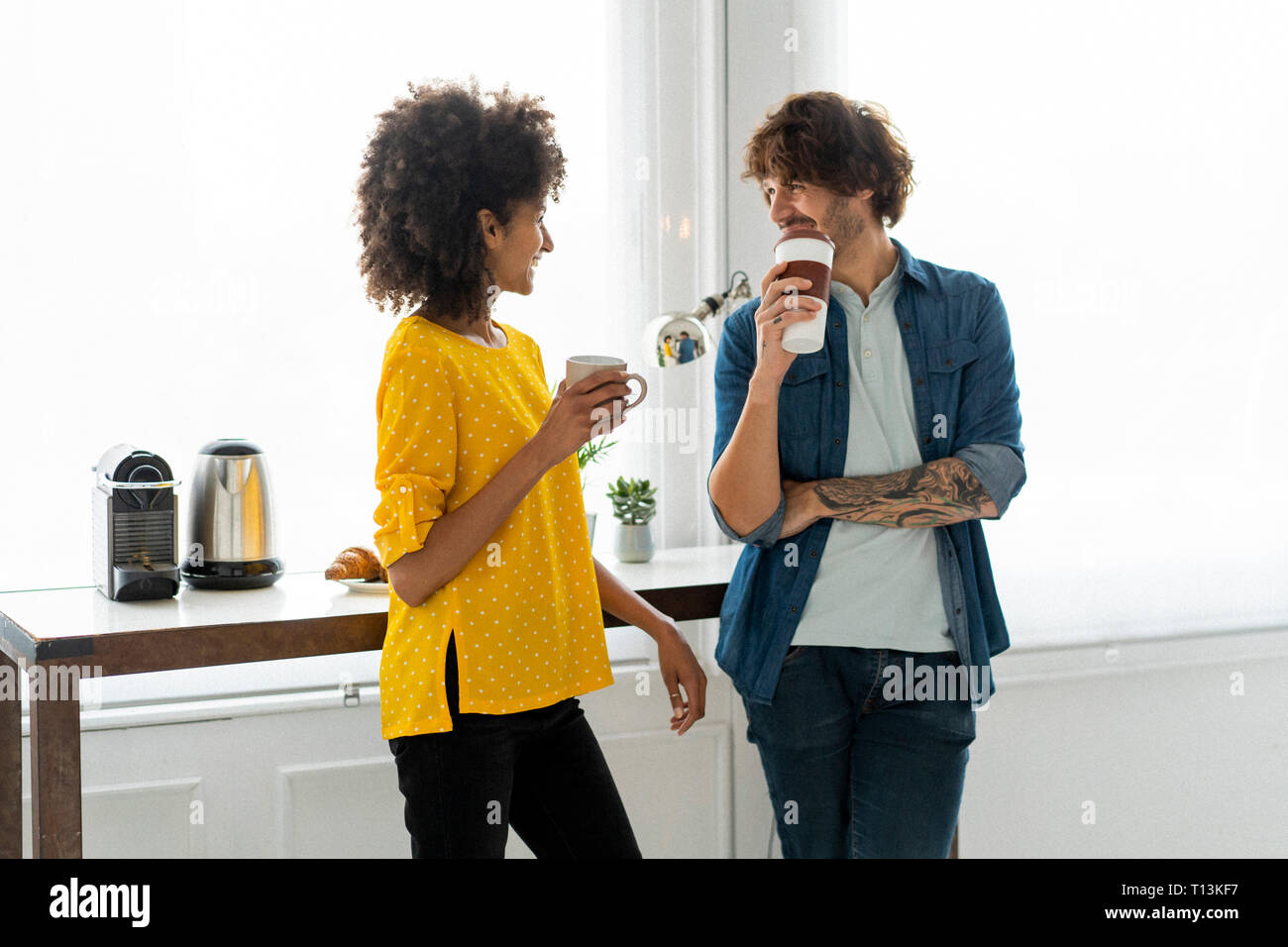 Colleagues having a coffee break in the office Stock Photo - Alamy