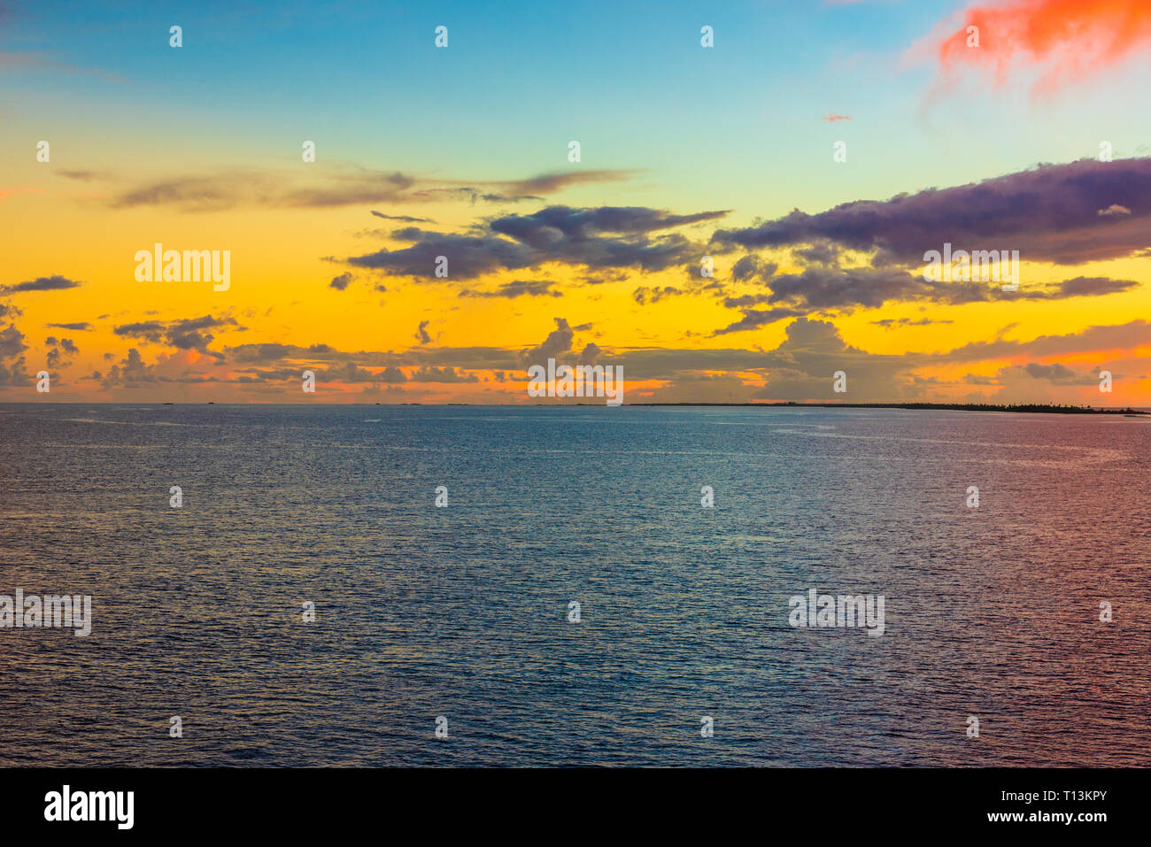 Sweeping photo looking over the blue waters of the Pacific as the sun ...