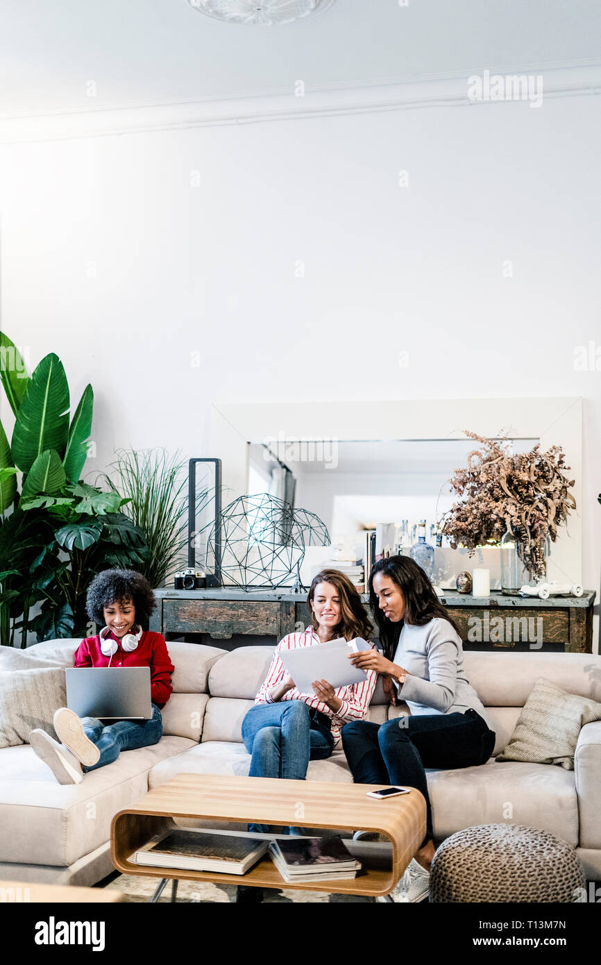 Three friends at home, living together Stock Photo - Alamy