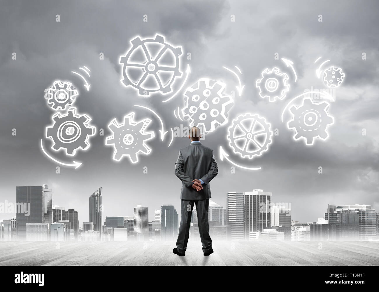 Cogwheel engine drawn on screen as symbol for teamwork and cooperation ...