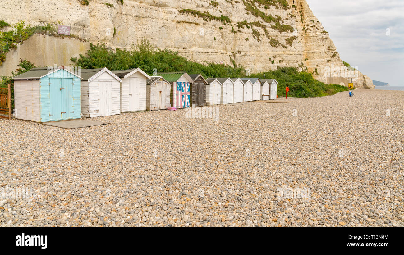 Beach huts on the pebble beach in Beer, Devon, UK Stock Photo - Alamy