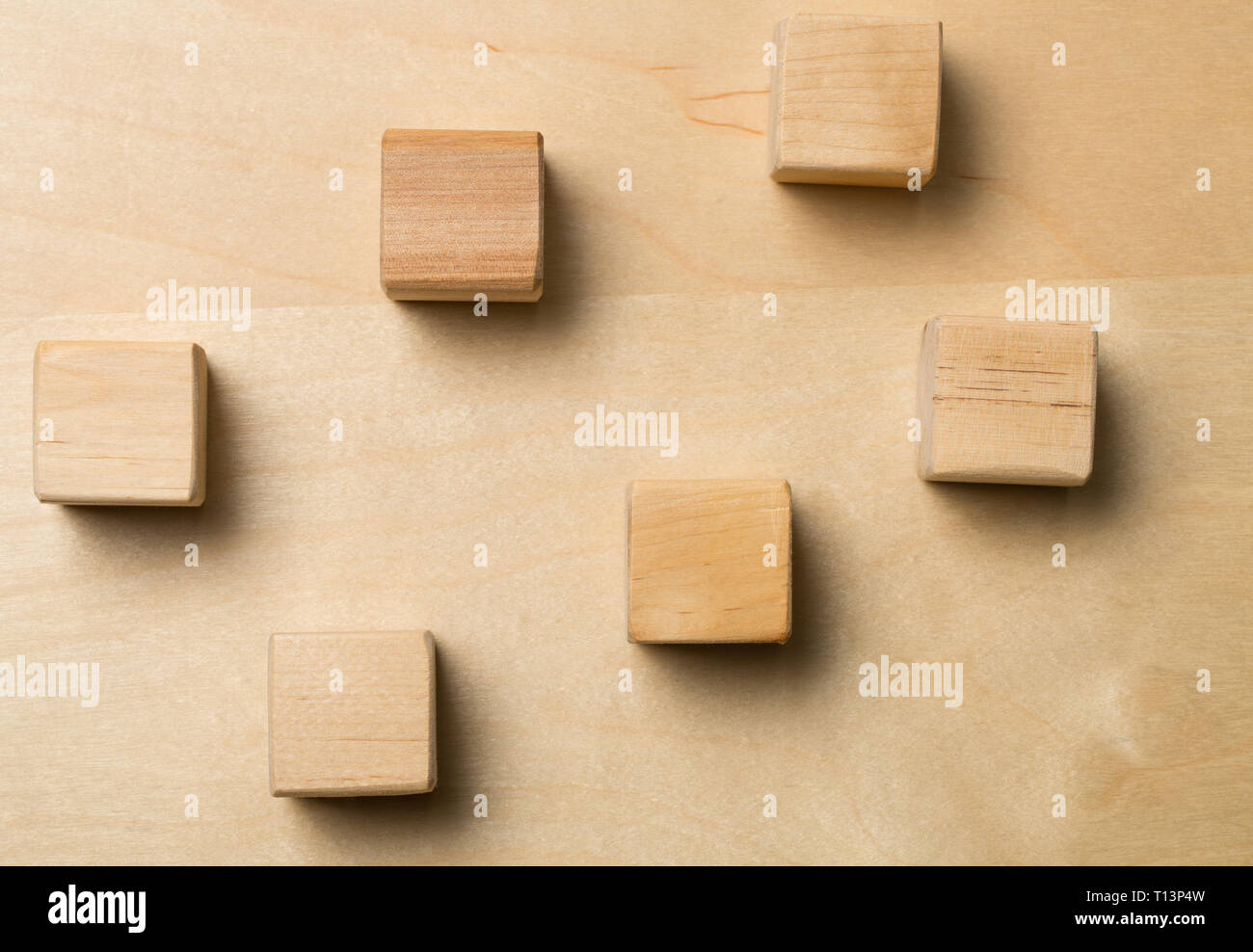Wooden cube blocks on brown wood background - shelves or bullet points ...