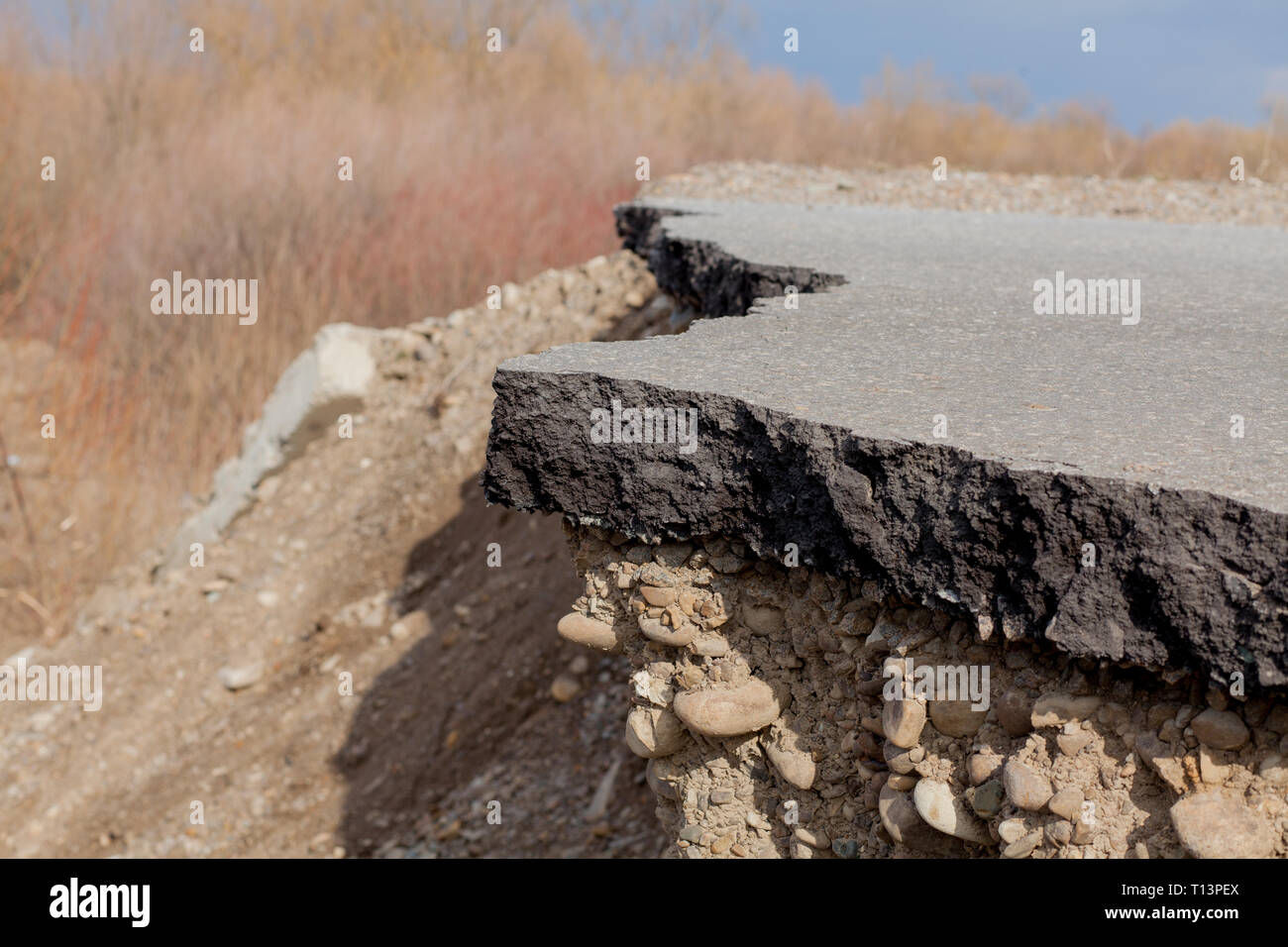Cross section of asphalt road with blue sky background Stock Photo - Alamy