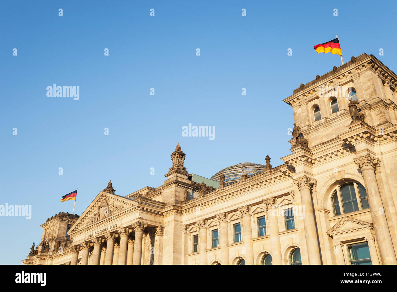 Germany, Berlin, Reichstag building and German flags Stock Photo - Alamy