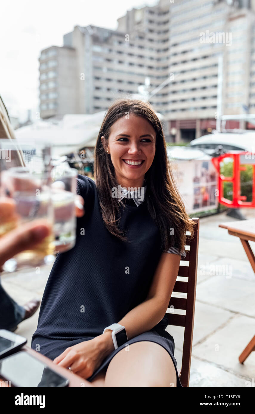 Young beautiful woman toasting with her friends on a terrace Stock ...