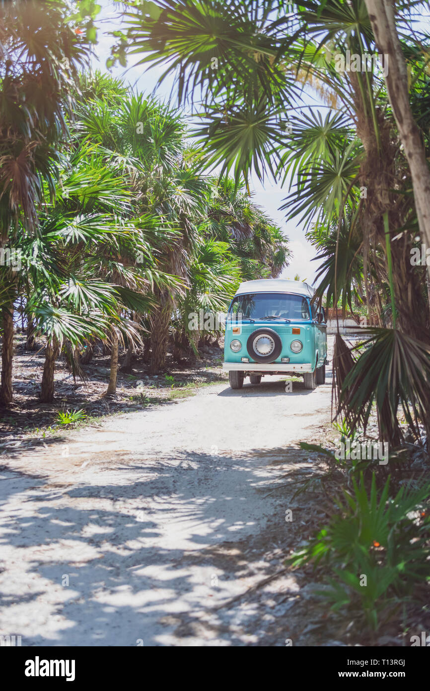 Mexico, Yucatan, Quintana Roo, Tulum, camper van on the beach with palm ...