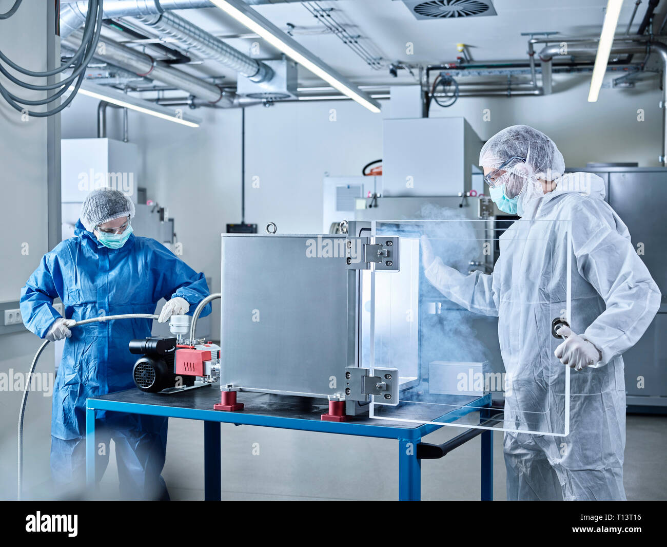 Chemists working in industrial laboratory clean room Stock Photo - Alamy