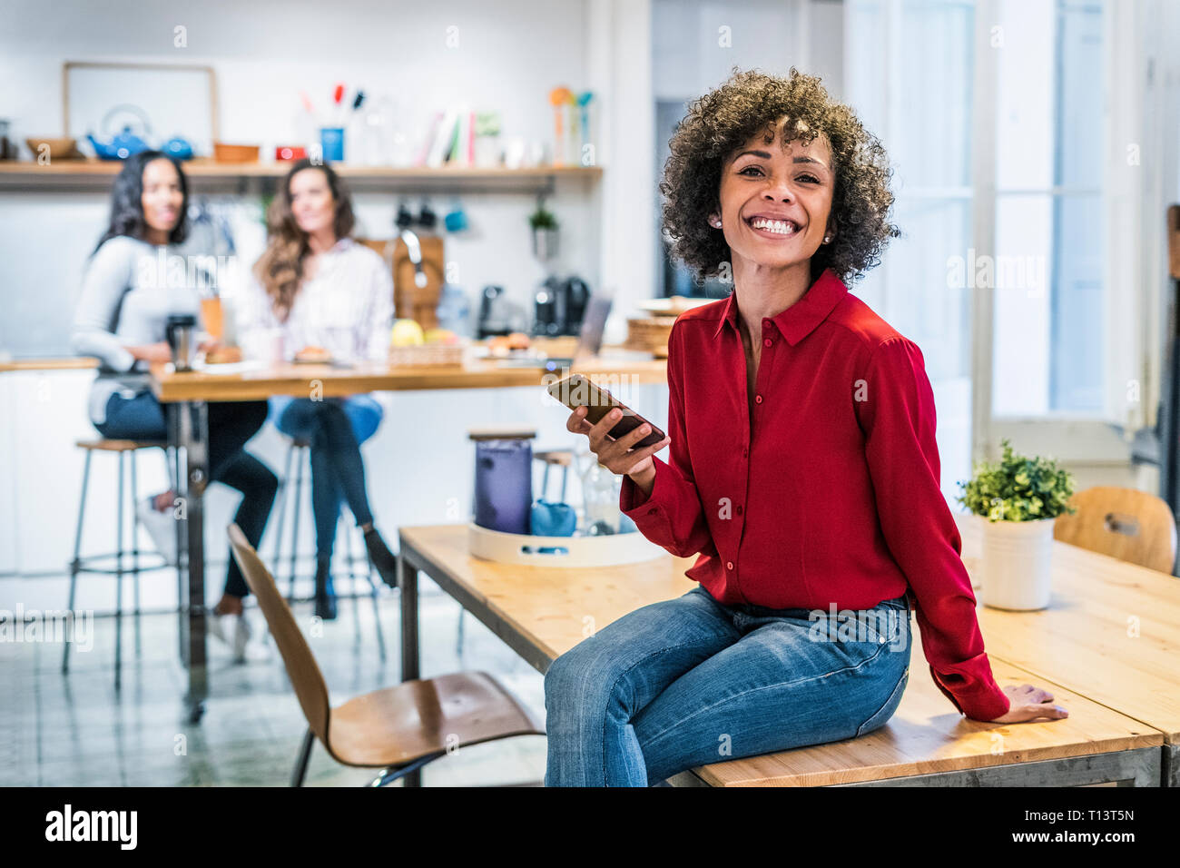 Three friends at home, living together Stock Photo - Alamy