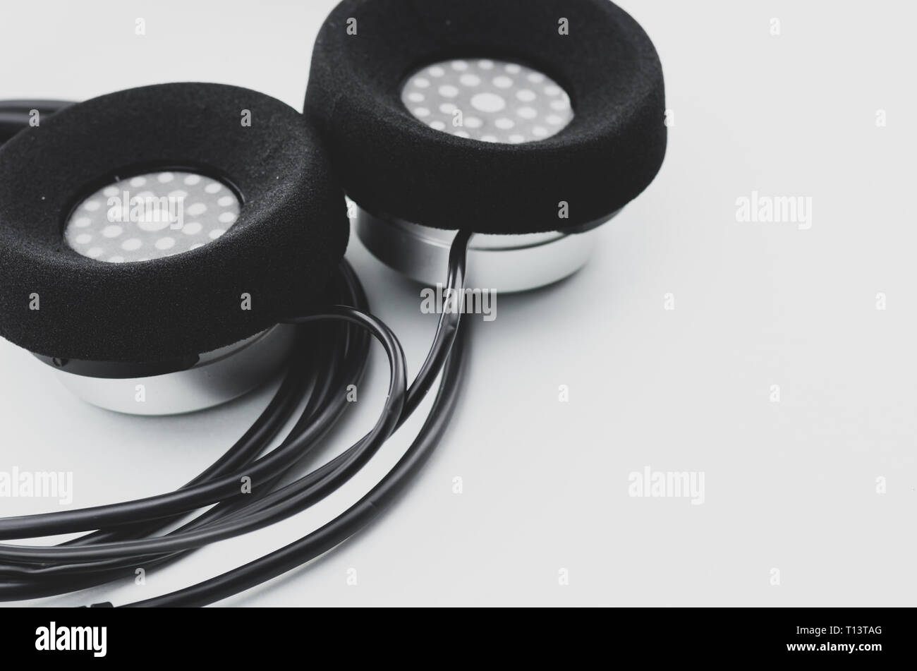 analog headphones on a white surface - top perspective Stock Photo - Alamy
