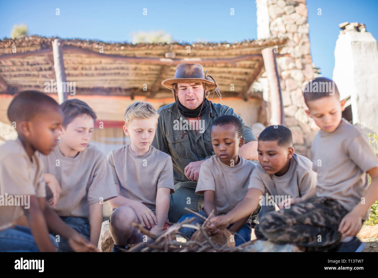 Children learning how to make a fire Stock Photo - Alamy