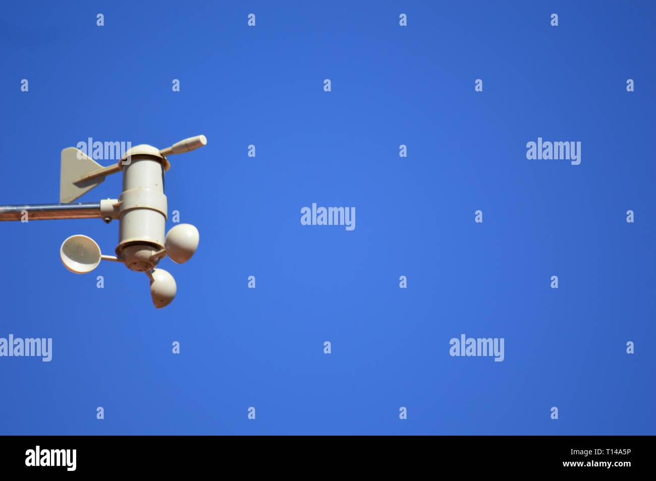 An anemometer with blue sky background Stock Photo - Alamy