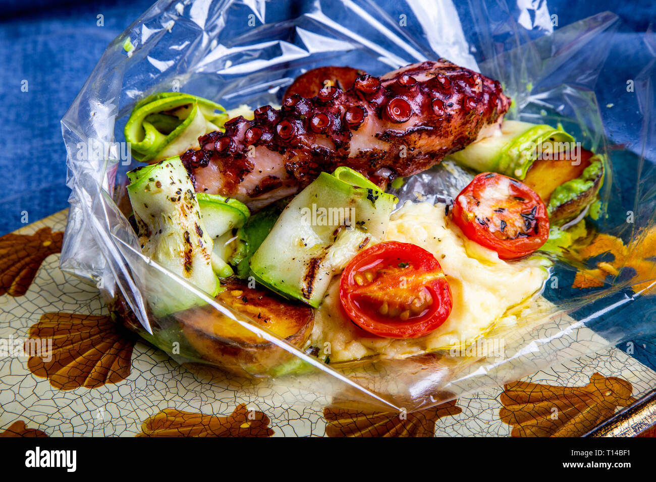 Luxurious seafood platter: octopus with vegetables. Banquet festive ...