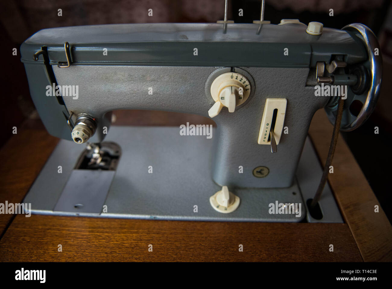 Old manual sewing machine on photo Stock Photo - Alamy