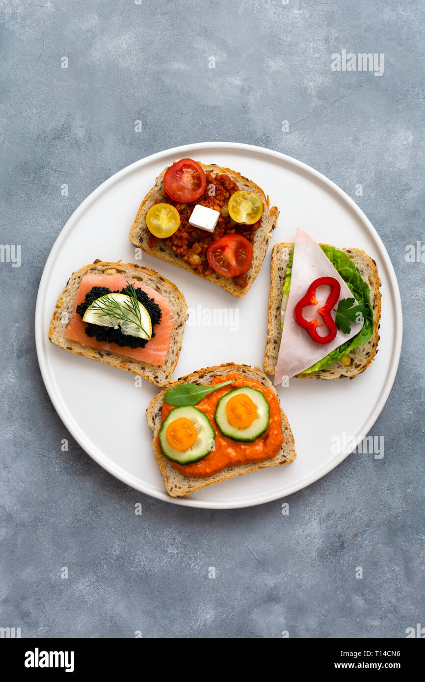 Breakfast toasts with various toppings. Healthy bruschetta. Bread ...