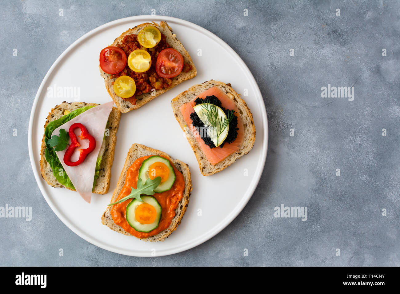 Breakfast toasts with various toppings. Healthy bruschetta. Bread ...