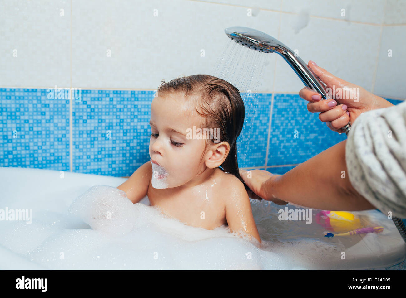 Child taking a bubble bath hi-res stock photography and images - Alamy