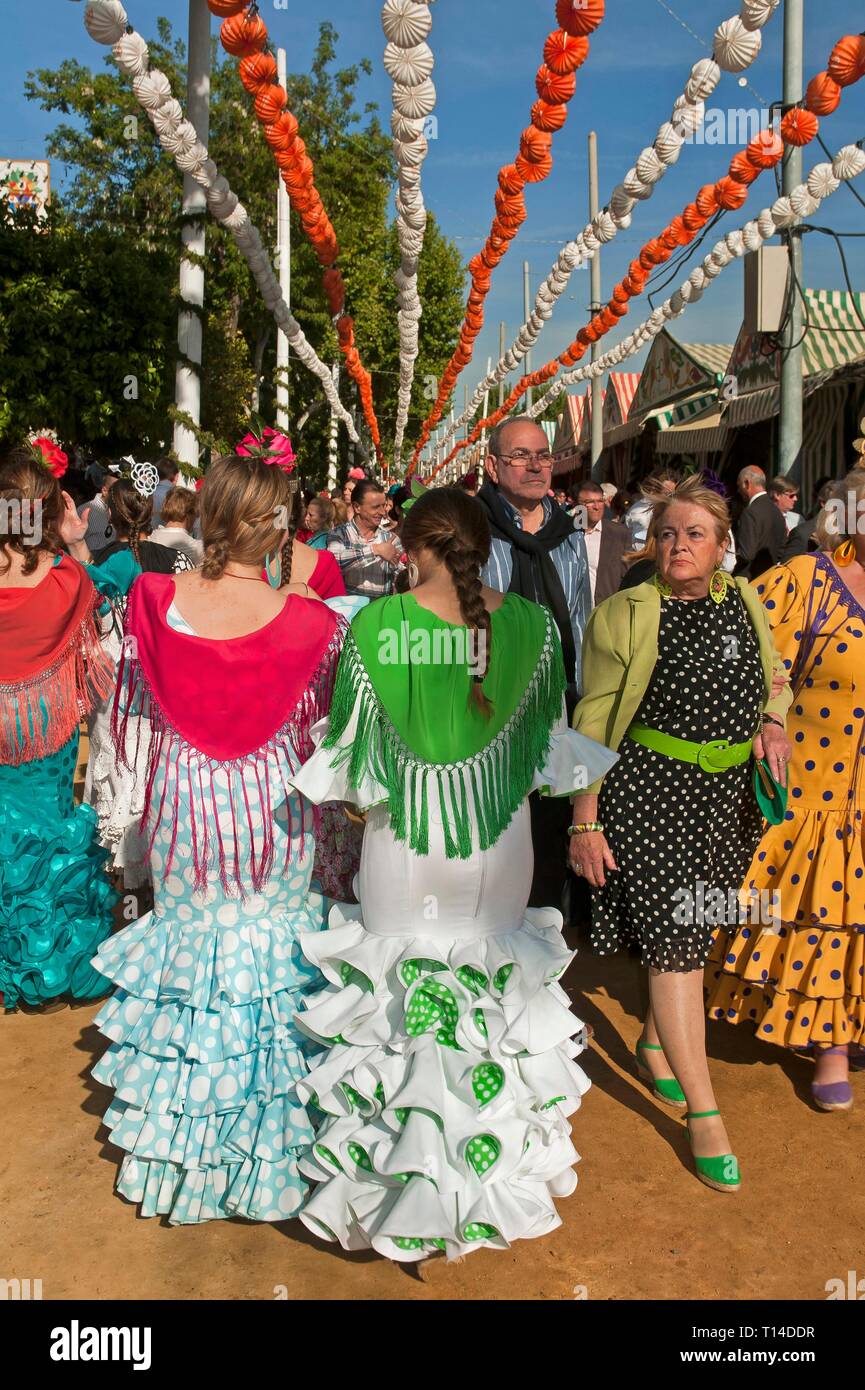 April Fair, Young women wearing a traditional flamenco dress, Seville ...