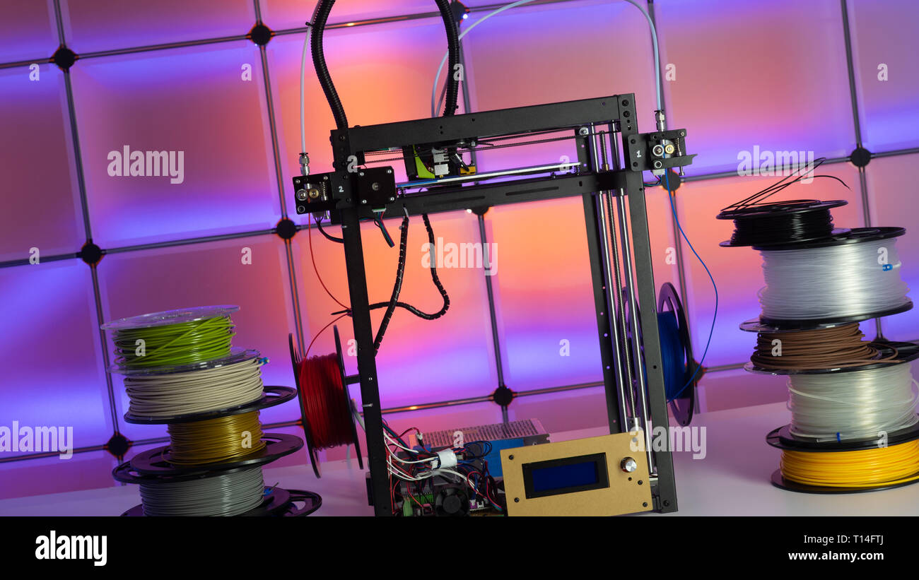 3d printer and plastic filament on color background Stock Photo - Alamy