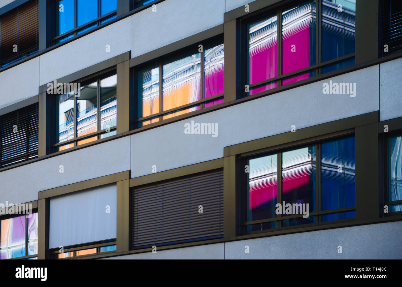 Reflections of colored wall in window front Stock Photo - Alamy