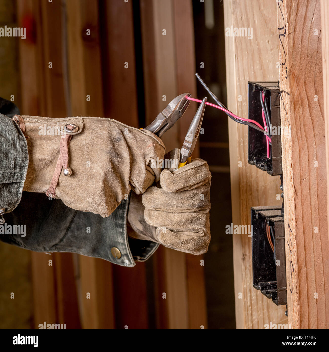 Electrician clips wires in an electrical box Stock Photo - Alamy