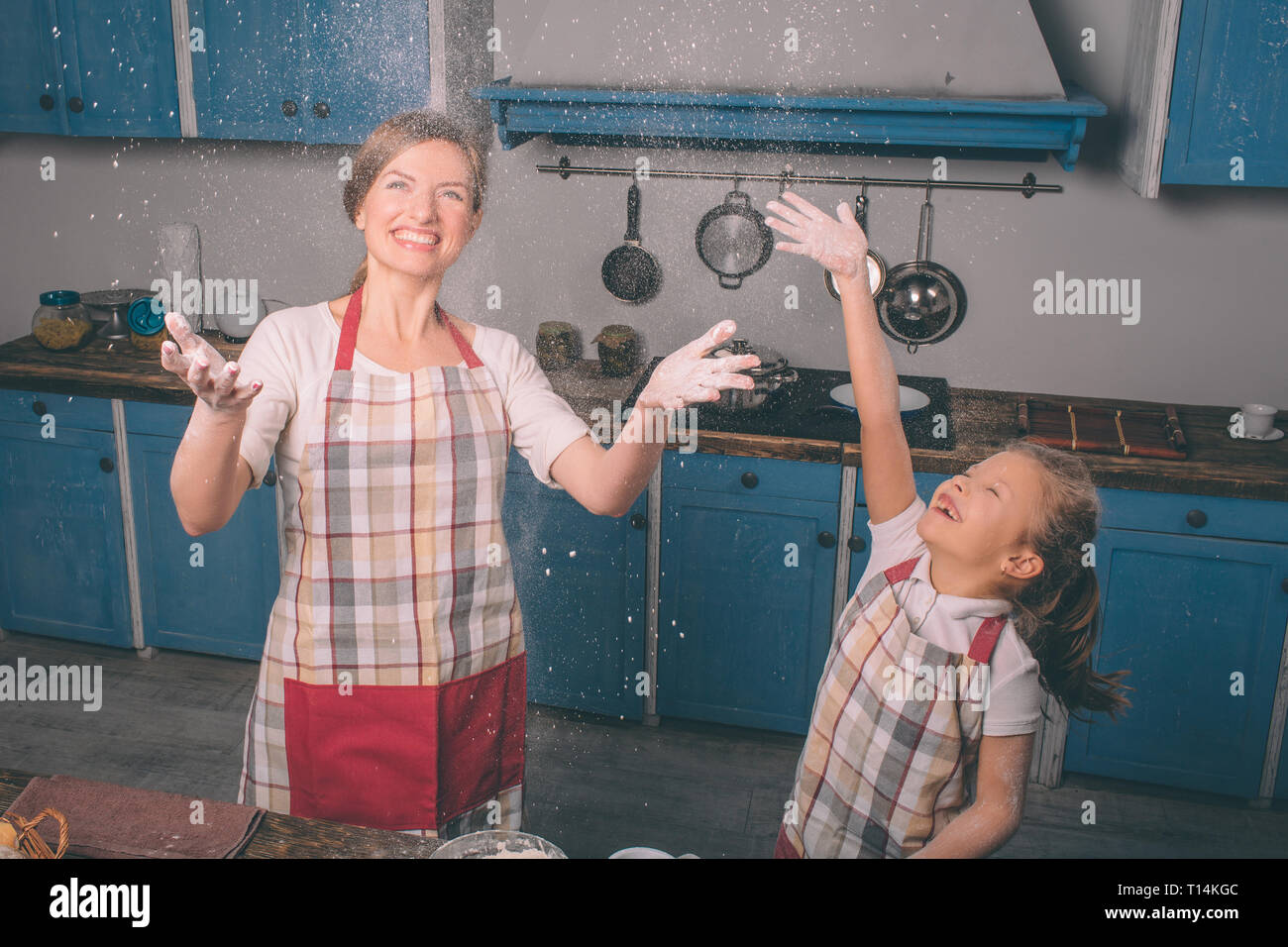 Playing with flour. Cooking homemade cakes. Happy loving family are ...