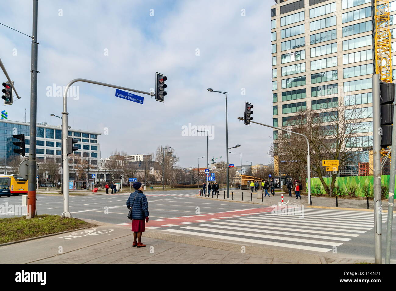 Warsaw Poland. February 18, 2019. Elderly woman stands in front of a ...