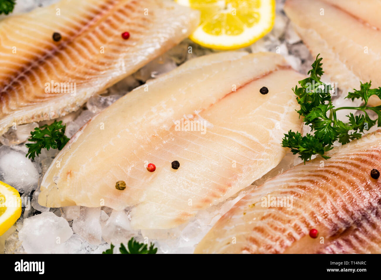 Whitefish Tilapia Fish Raw Fillet on Ice Stock Photo - Alamy