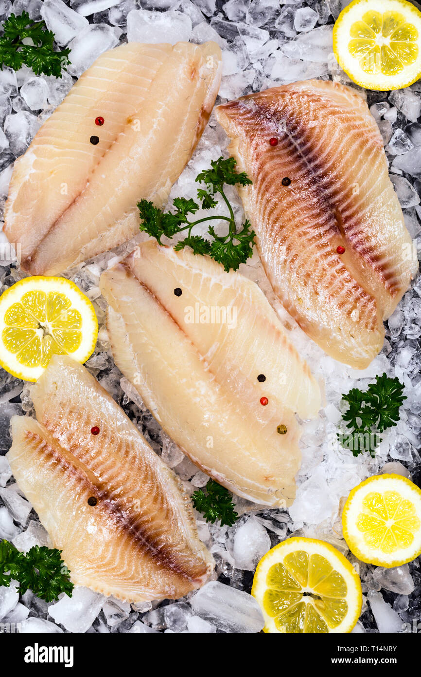 Whitefish Tilapia Fish Raw Fillet on Ice Stock Photo - Alamy