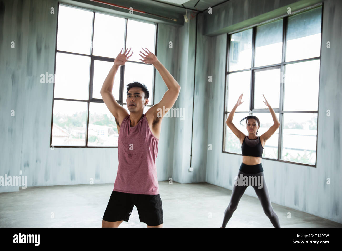 Men lead movement exercises followed member behind him Stock Photo - Alamy