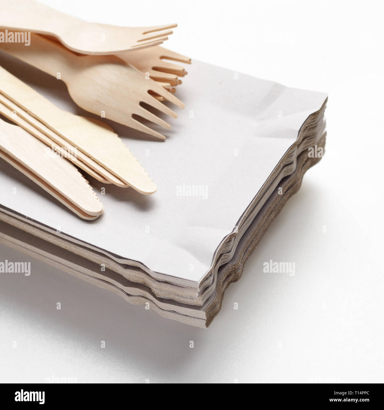 Wooden single use kitchenware and paper plate on white background ...